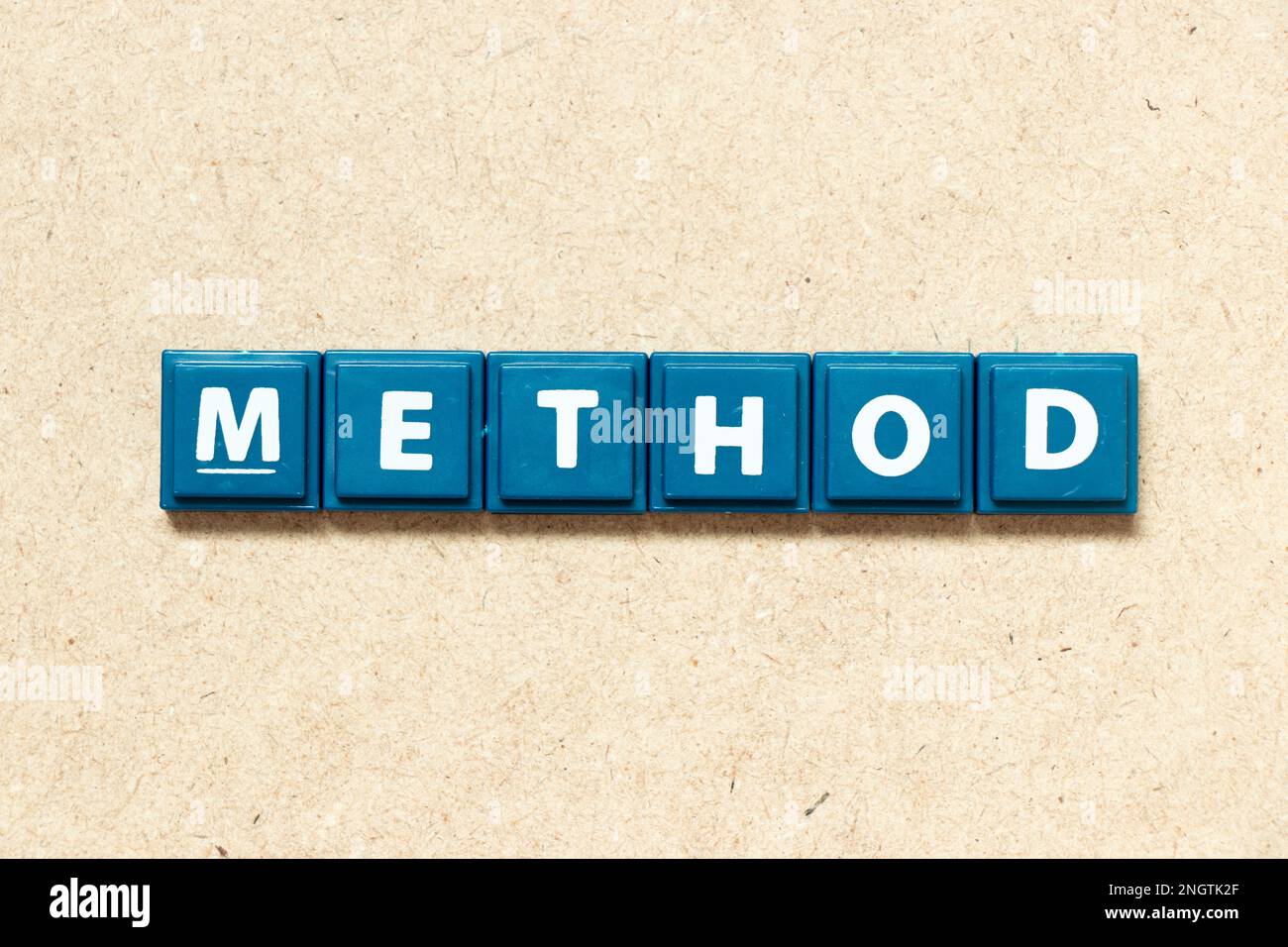 Tile alphabet letter in word method on wood background Stock Photo - Alamy