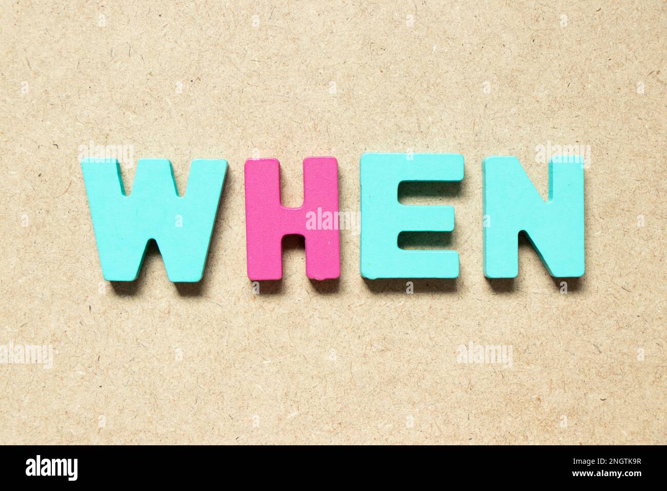 Color alphabet letter in word when on wood background Stock Photo - Alamy