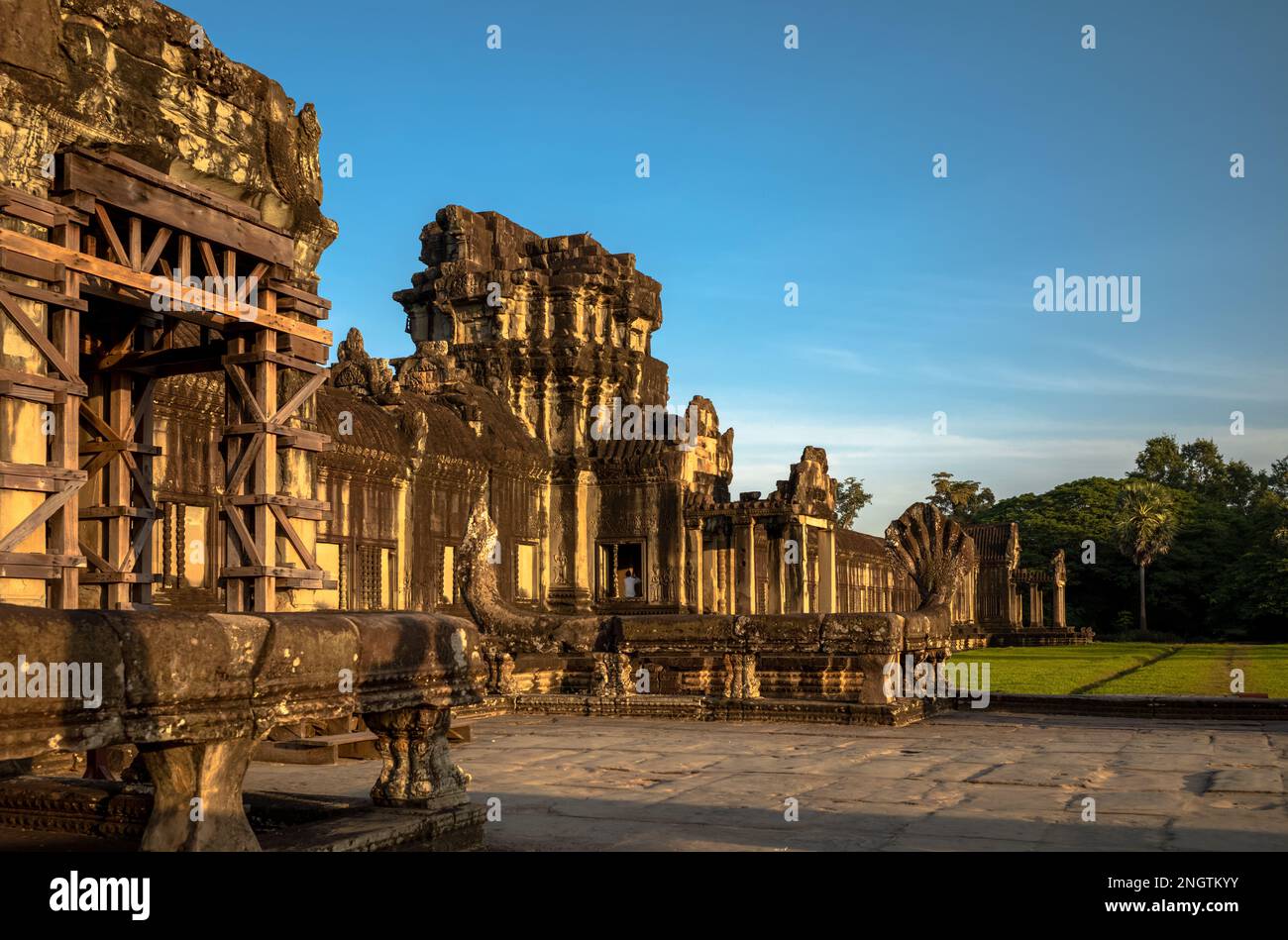 The west gate into the famed temple of Angkor Wat showing timber ...