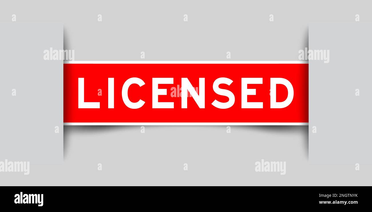Inserted red color label sticker with word licensed on gray background ...