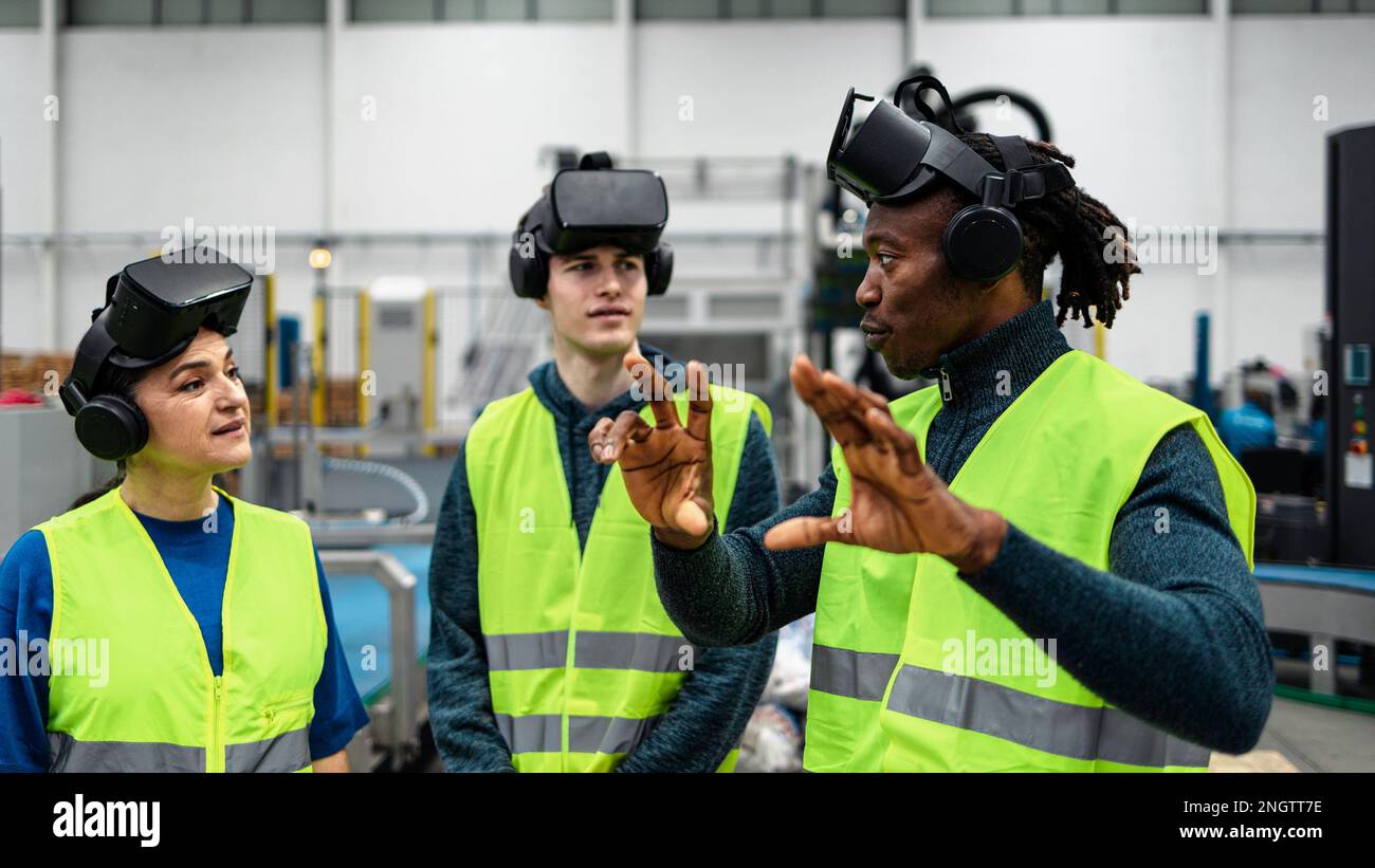 Team of multiracial engineers having a simulation experience with ... Team of multiracial engineers having a simulation experience with ...