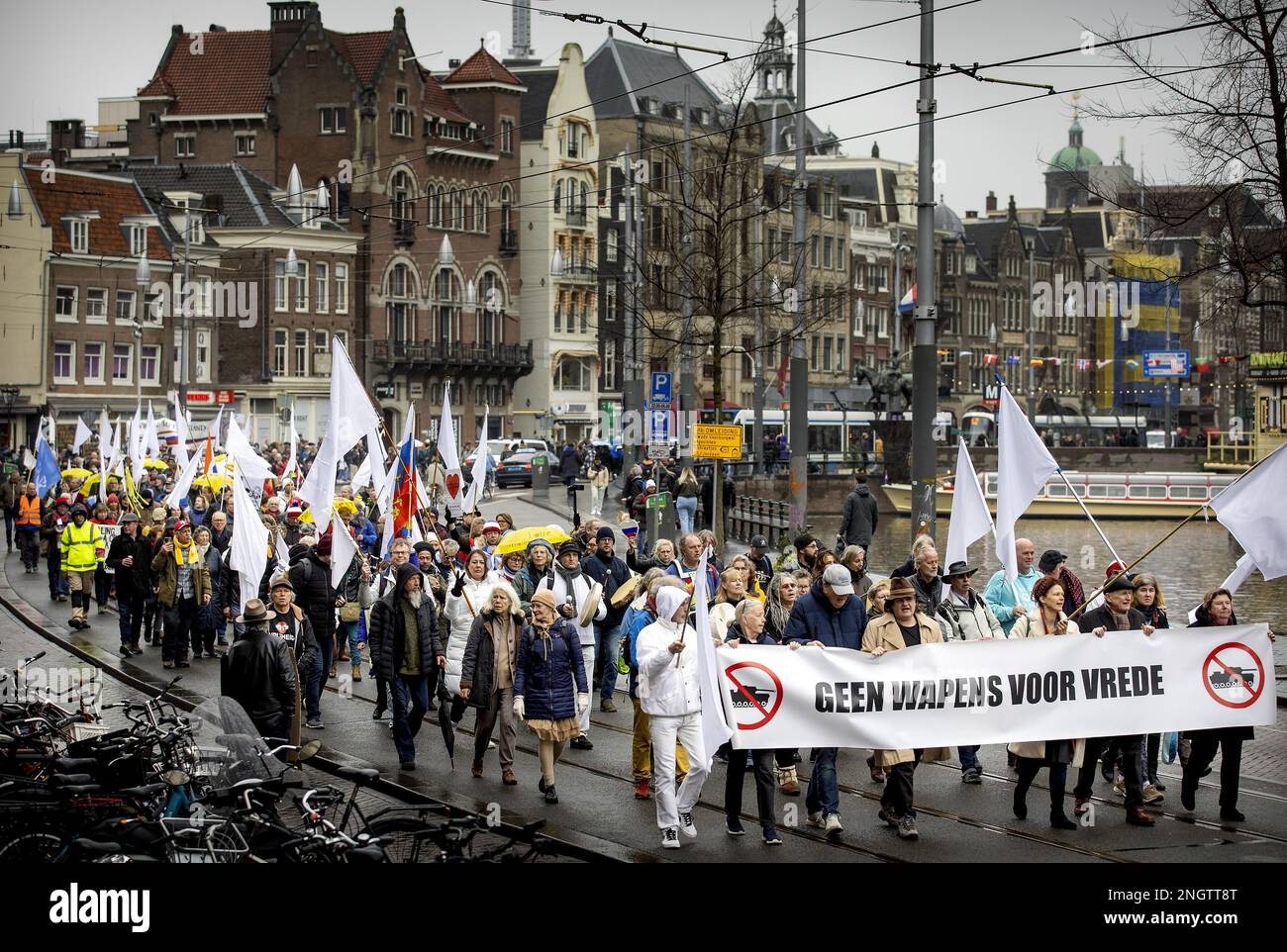 AMSTERDAM - Participants walk in a white flag march through the center ...