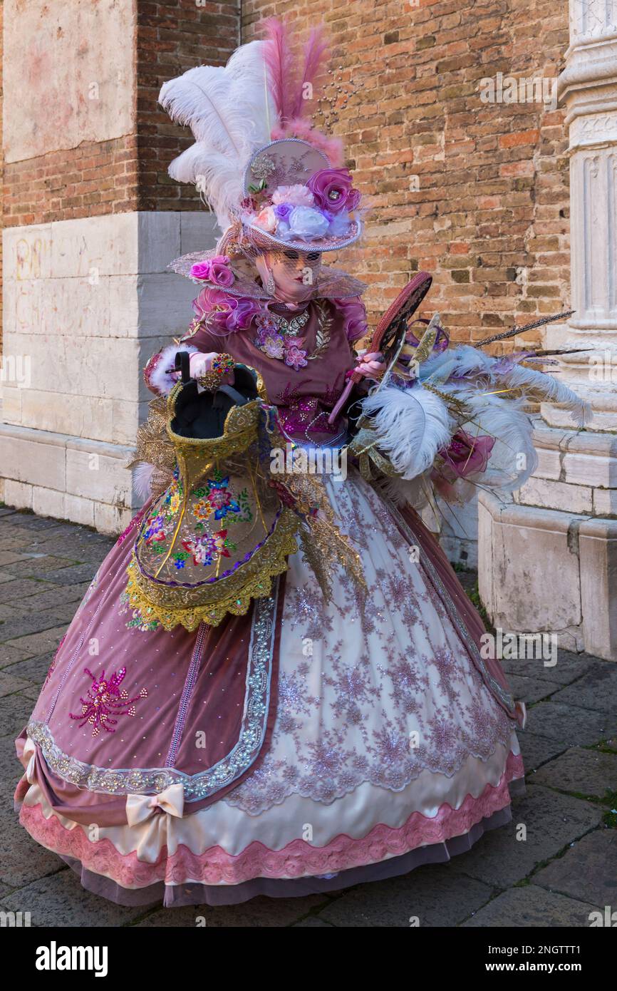 Carnival goer dressed in splendid costume and mask during Venice ...