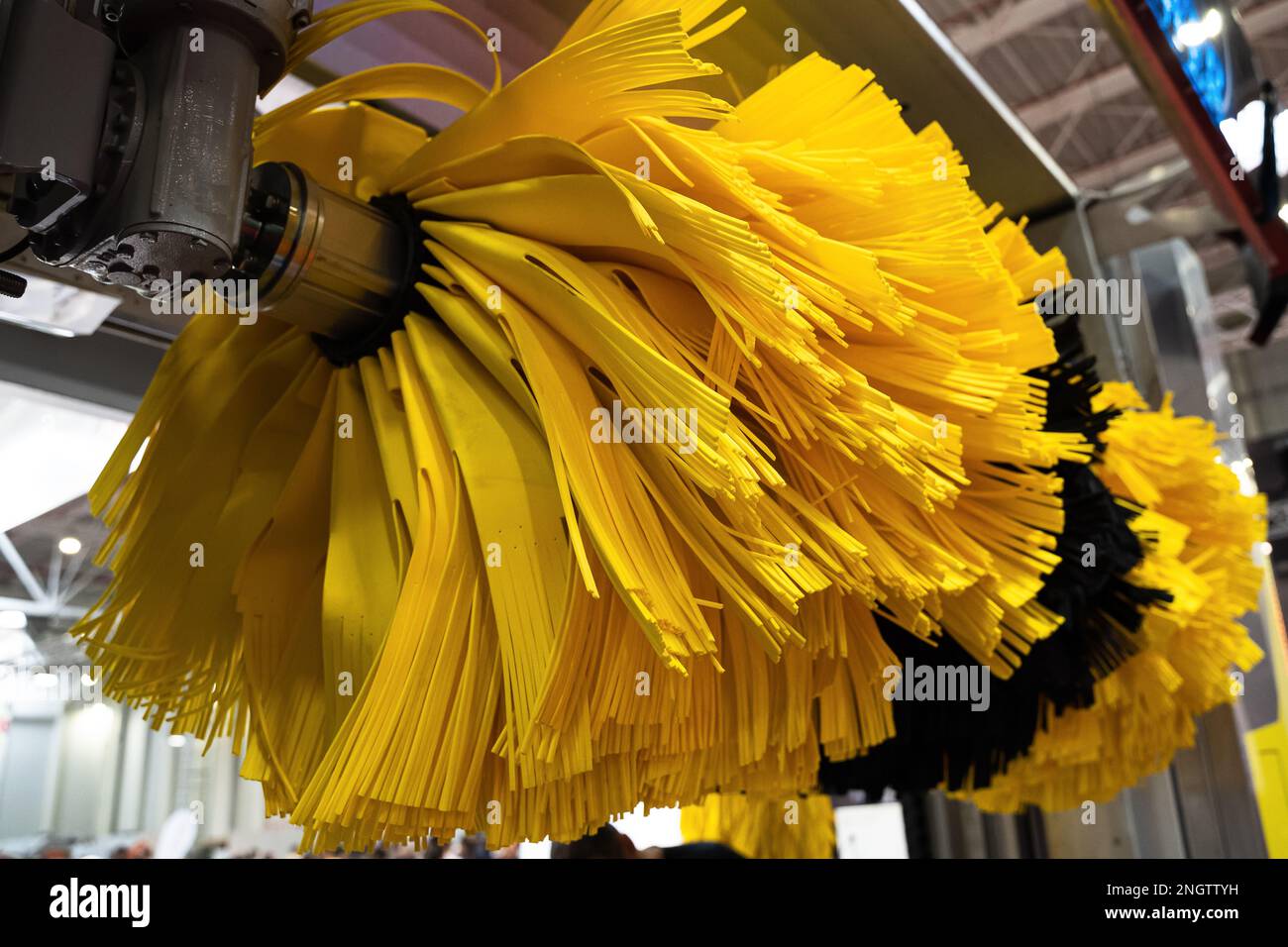 front view closeup detail of black and yellow automatic car wash system ...