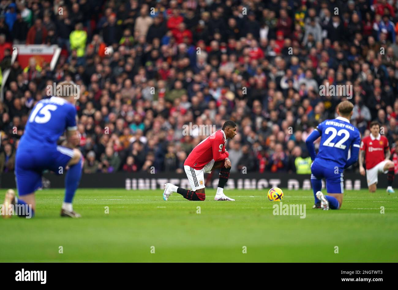 Manchester United's Marcus Rashford takes a knee ahead of the Premier ...