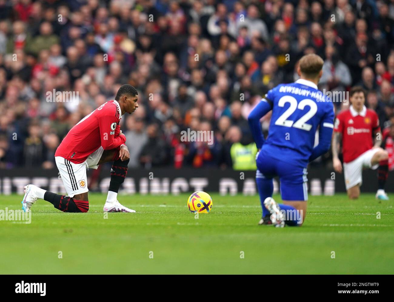 Manchester United's Marcus Rashford (left) takes a knee ahead of the ...
