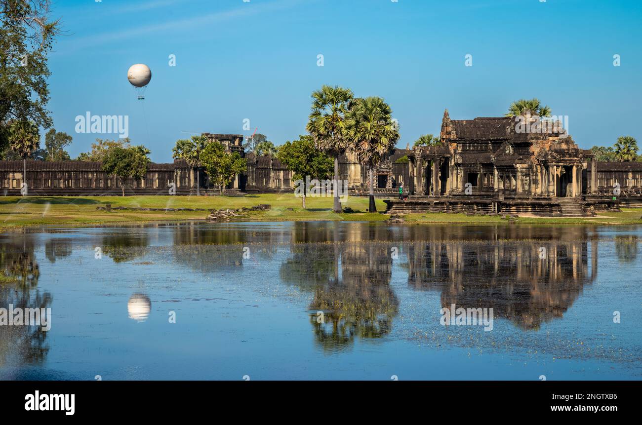 A sight-seeing hot air balloon rises up above the famed ancient temple ...