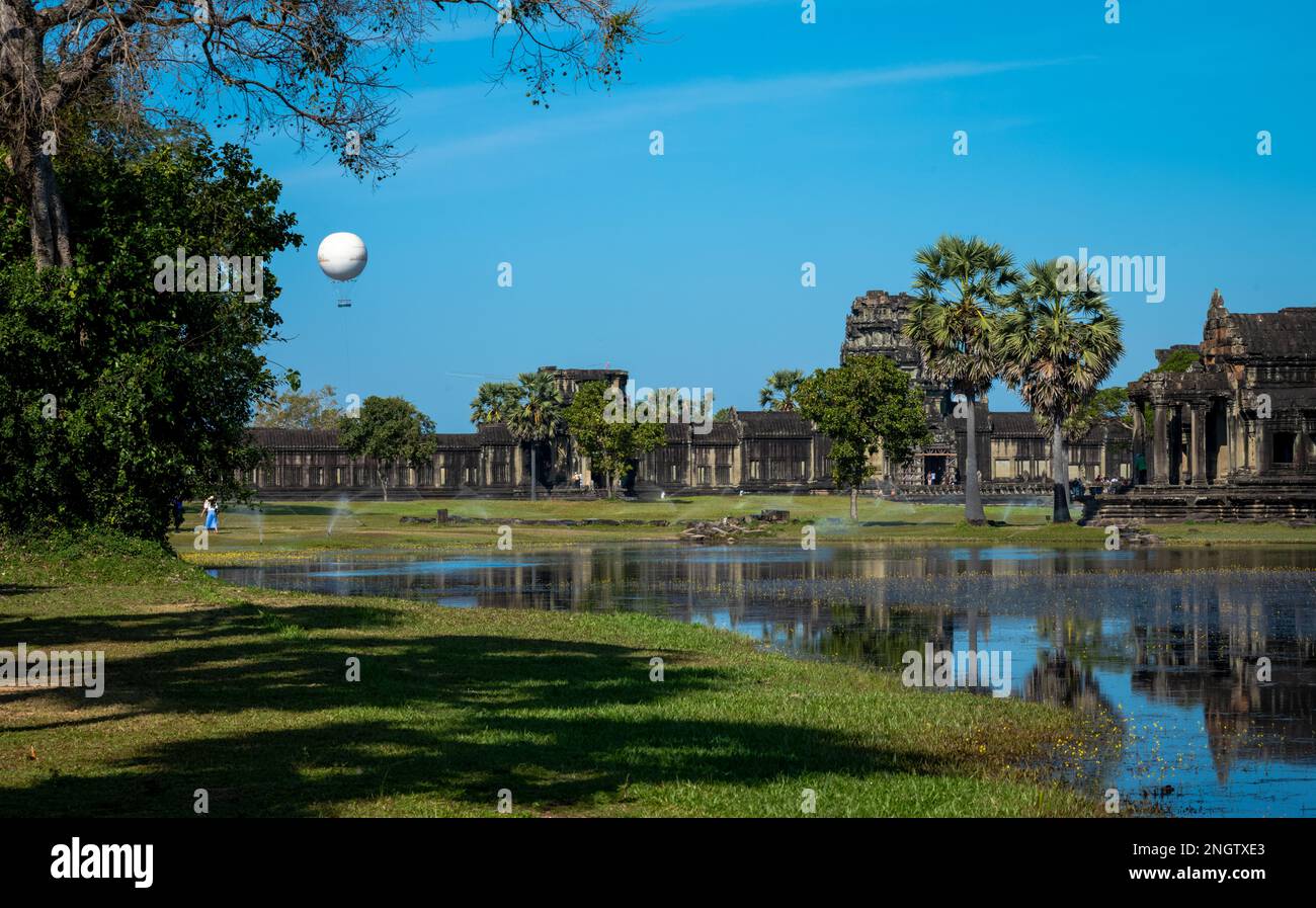 A sight-seeing hot air balloon rises up above the famed ancient temple ...