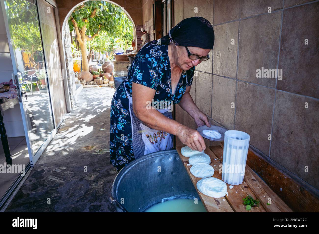 Mrs Sofia making Halloumi chesse in Sofia And Andreas Traditional House ...