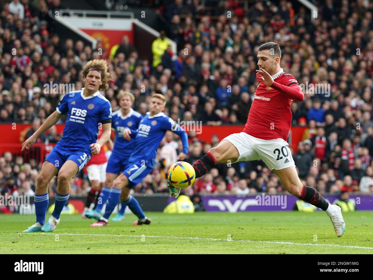 Manchester United's Diogo Dalot (right) attempts a shot on goal during ...