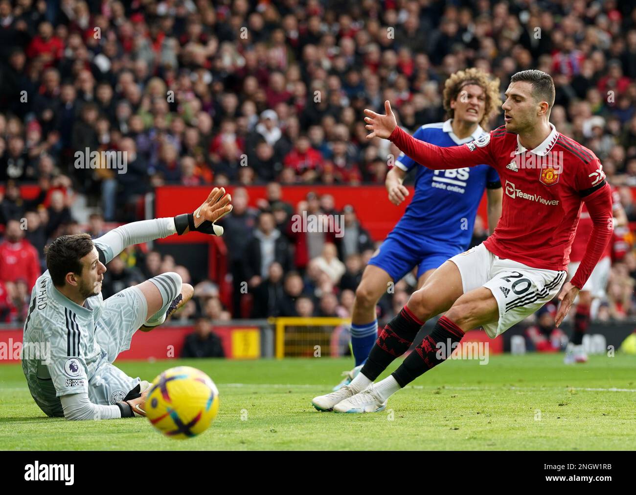 Manchester United's Diogo Dalot (right) attempts a shot on goal during ...