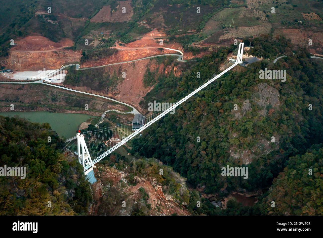 Admire the Bach Long Glass Bridge in the sunset from above. This is the ...