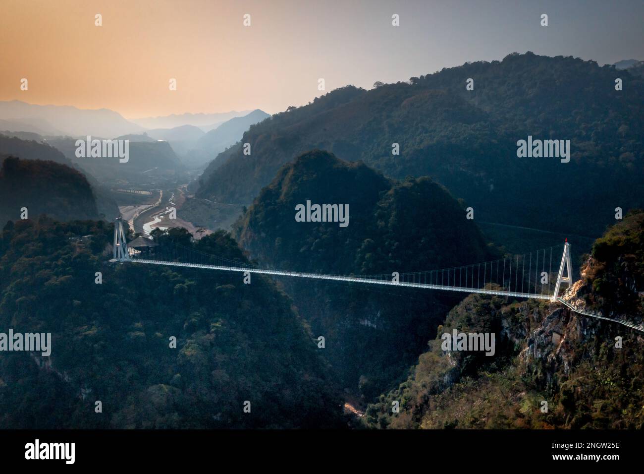 Admire the Bach Long Glass Bridge in the sunset from above. This is the ...