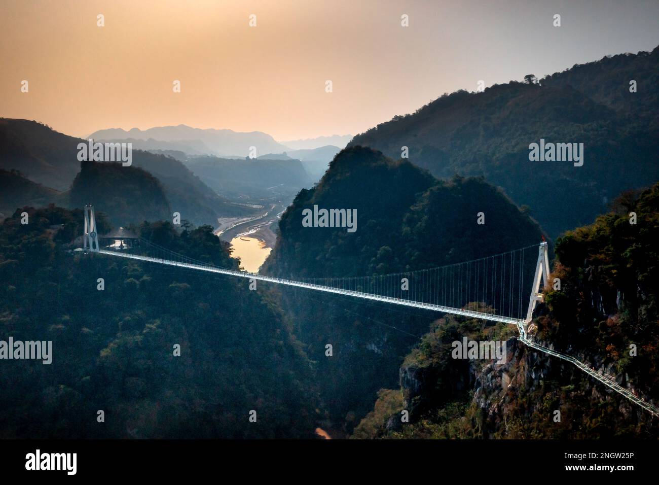 Admire the Bach Long Glass Bridge in the sunset from above. This is the ...