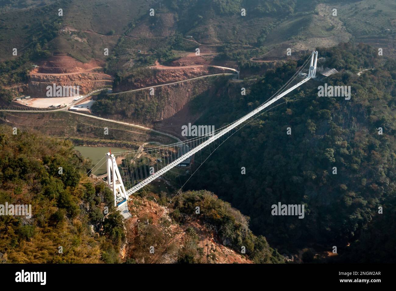 Admire the Bach Long Glass Bridge in the sunset from above. This is the ...