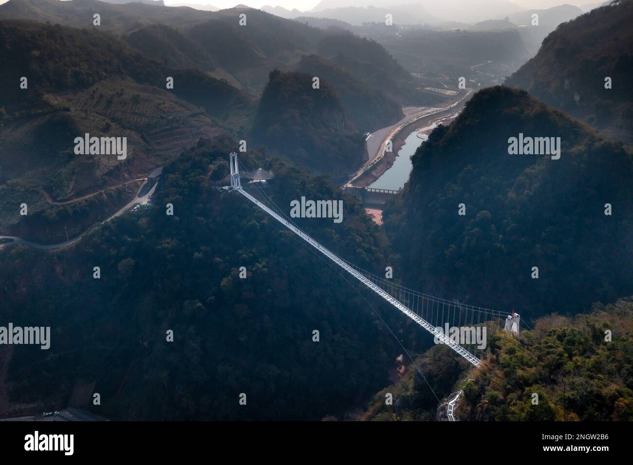 Admire the Bach Long Glass Bridge in the sunset from above. This is the ...