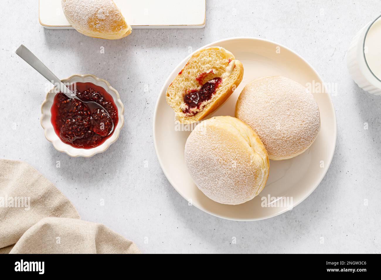 Berliner donut. Traditional german donut with raspberry jam, dusted ...