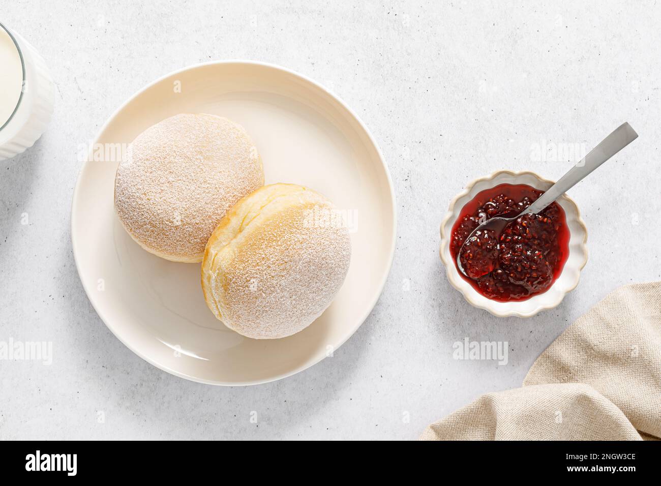 Berliner donut. Traditional german donut with raspberry jam, dusted ...