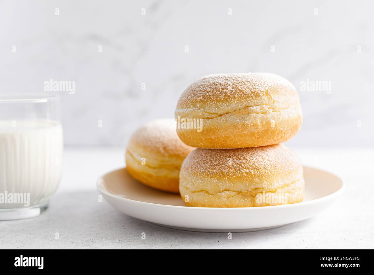 Berliner donut. Traditional german donut with raspberry jam, dusted ...
