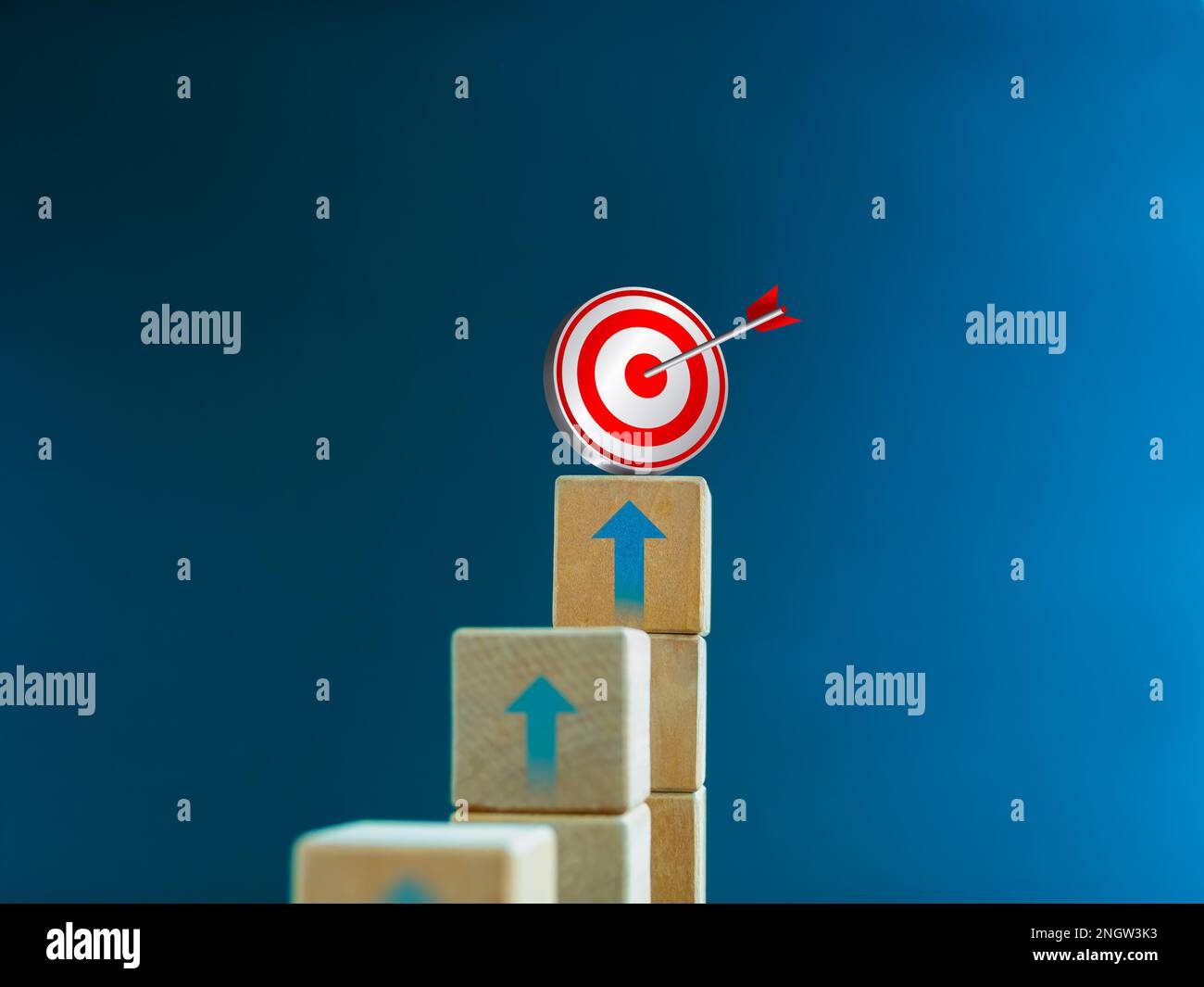 3d target icon on the top of wooden cube blocks, bar graph chart steps with up arrows on blue ...