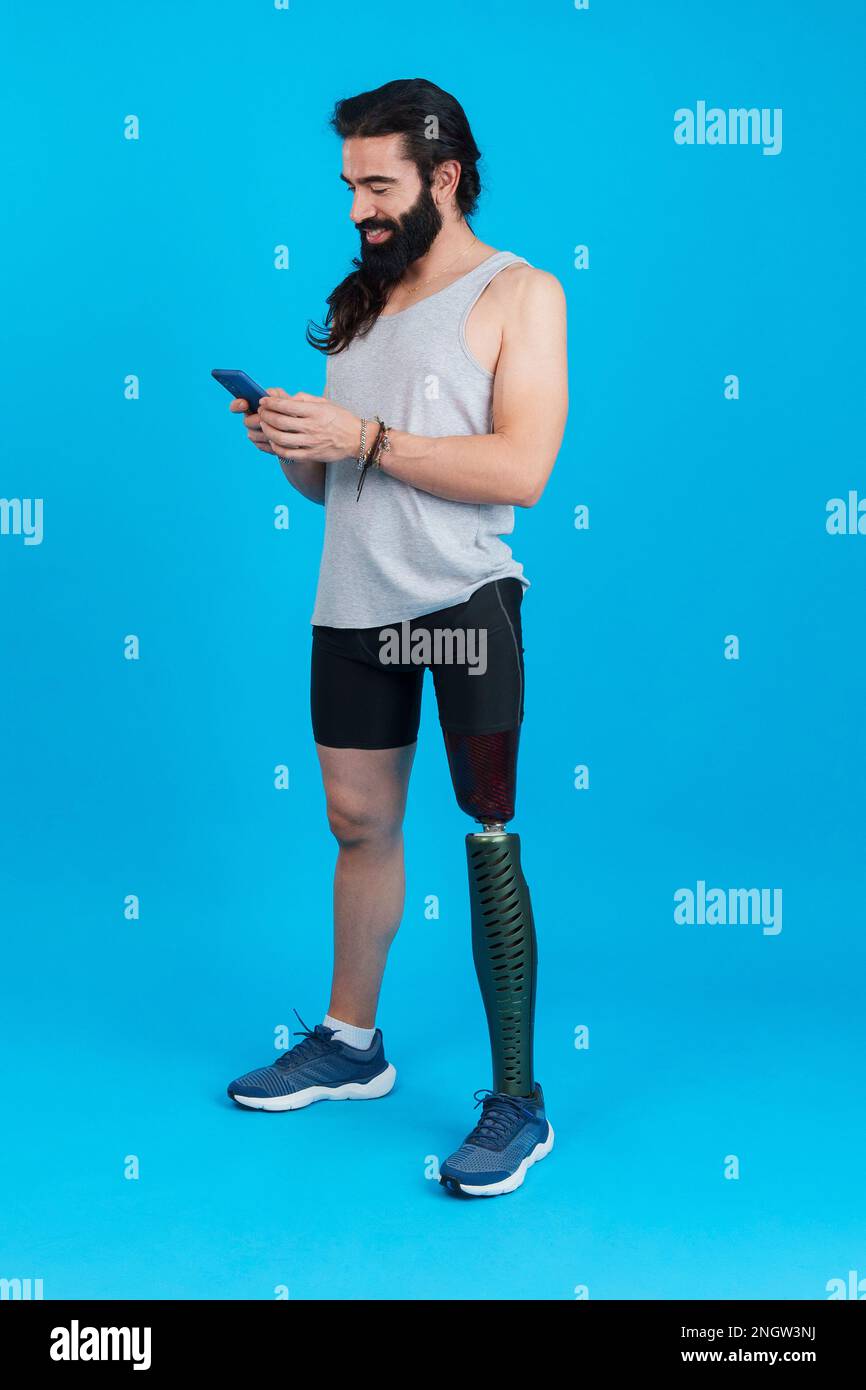 Smiling man using cellphone hi-res stock photography and images - Alamy