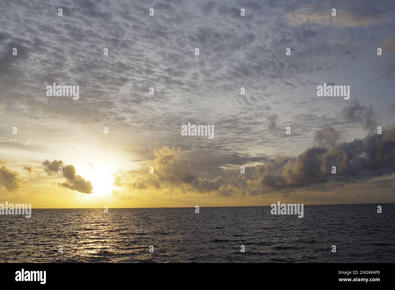 Sun setting at Helengeli, Maldives Stock Photo - Alamy