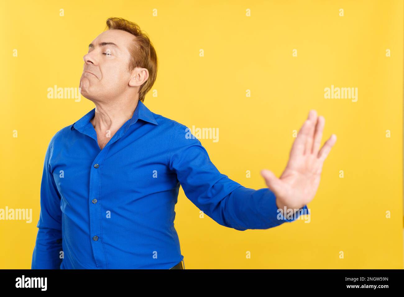 Mature man rejecting while gesturing with his hand Stock Photo - Alamy