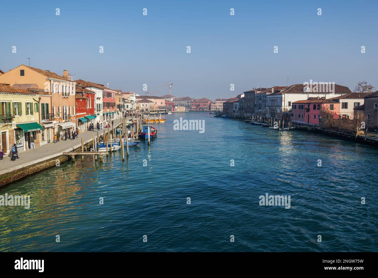 Murano, Italy day view of main canal with low-rise colorful buildings ...