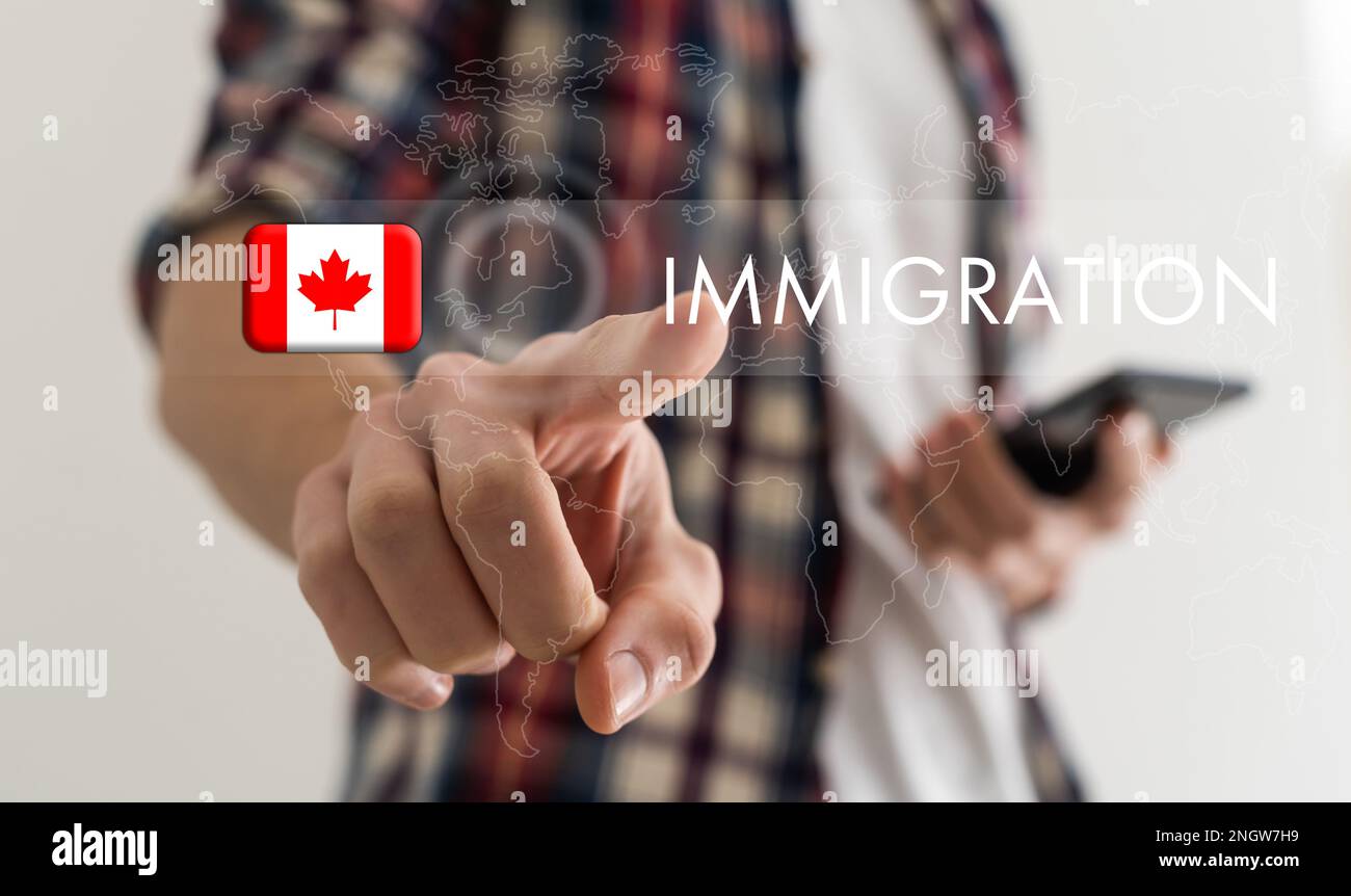 Man pointing at word IMMIGRATION and world map on dark blue background ...