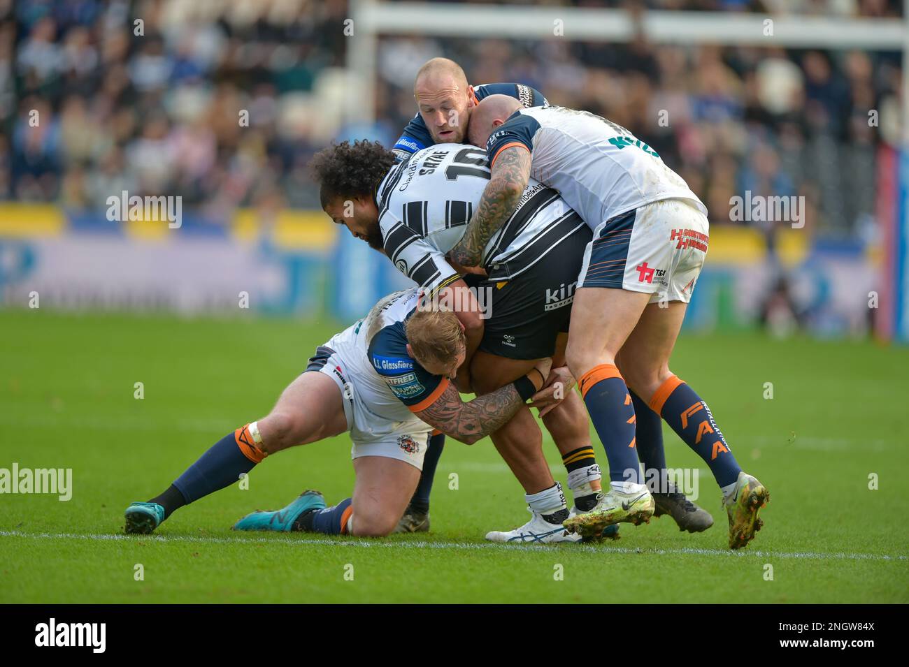 Hull, UK. 19th Feb, 2023. Chris Satae of Hull FC tackled by Liam Watts ...