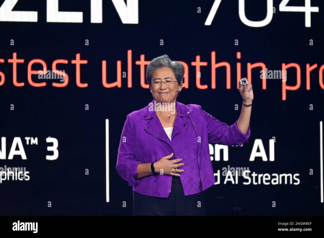 AMD CEO Lisa Su holds up a Ryzen 7040 series chip during her keynote ...