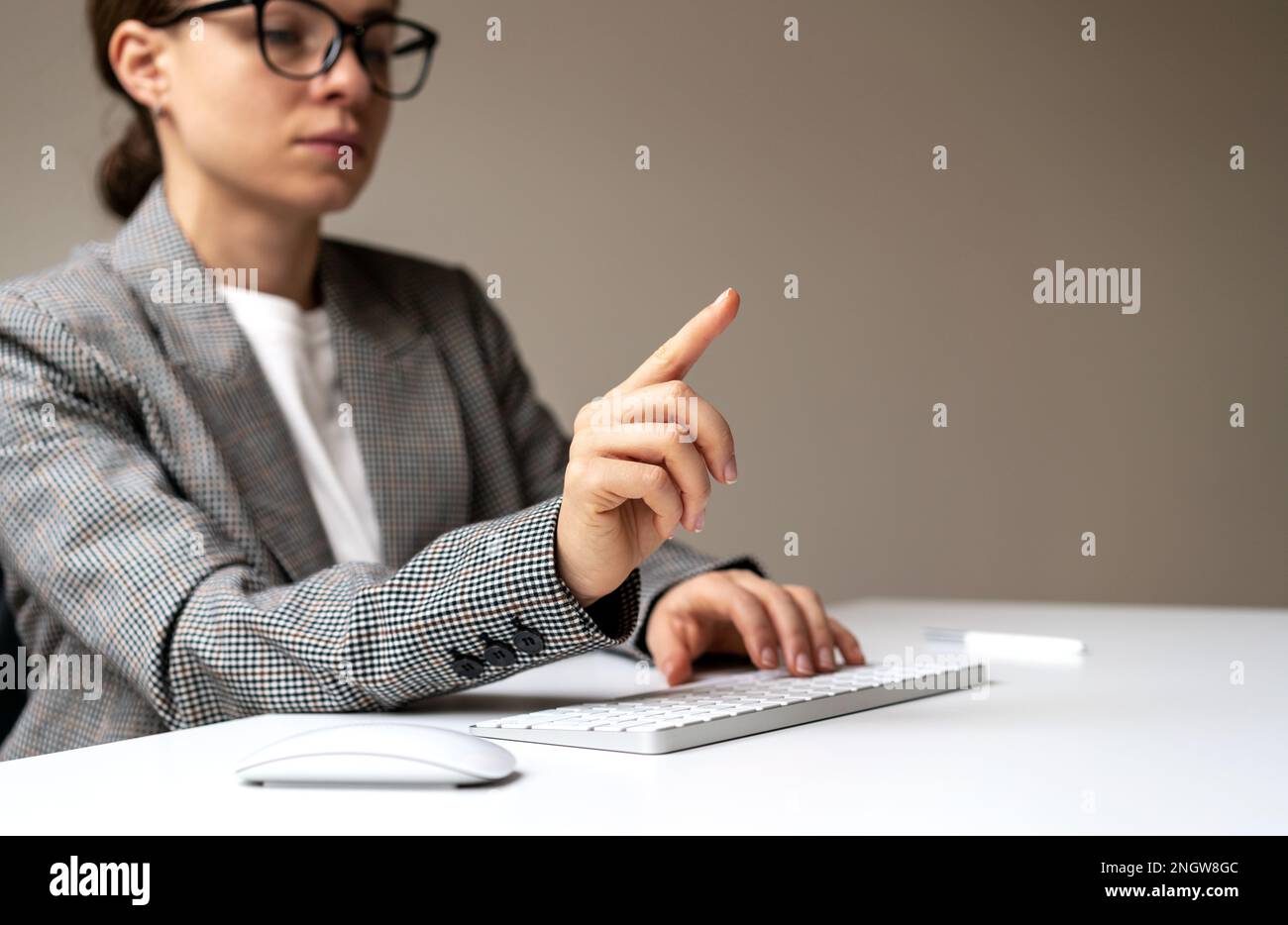 Businesswoman with glasses sitting desk working on computer touching ...