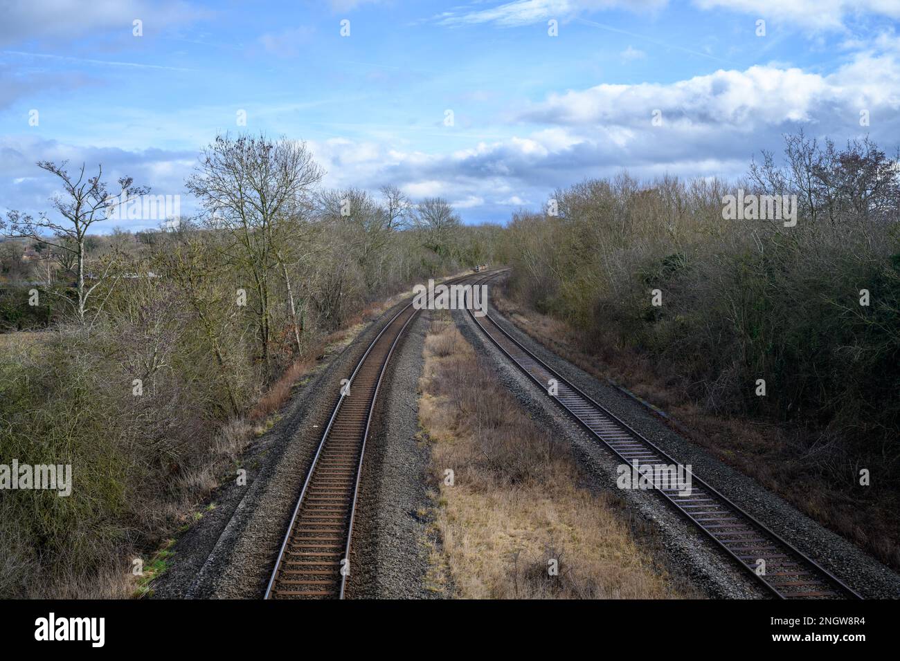 View over Railroad tracks disappearing in the distance Stock Photo - Alamy