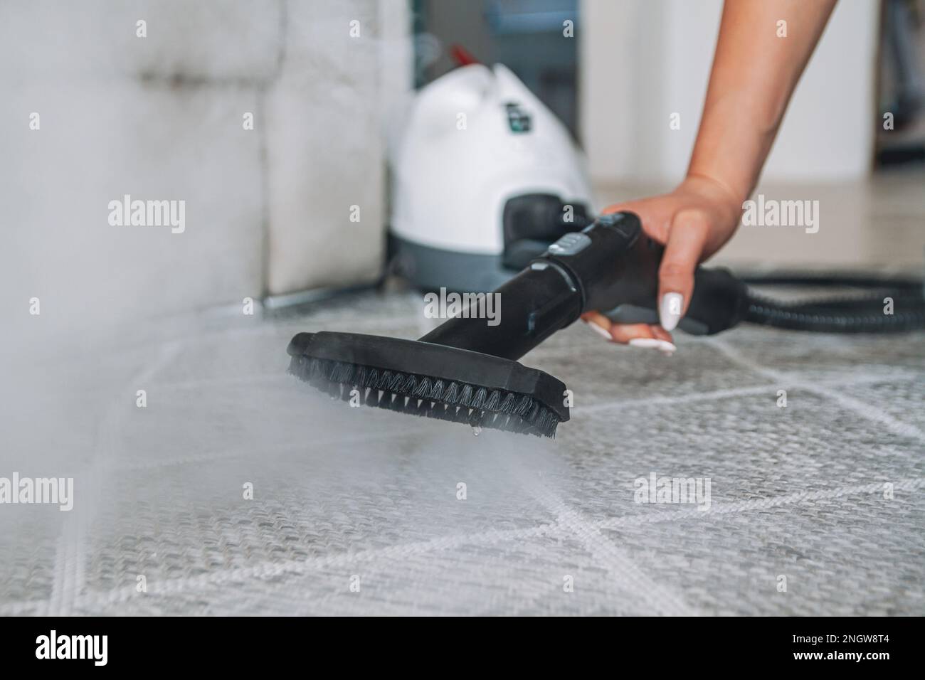 Using a steam cleaner hi-res stock photography and images - Alamy