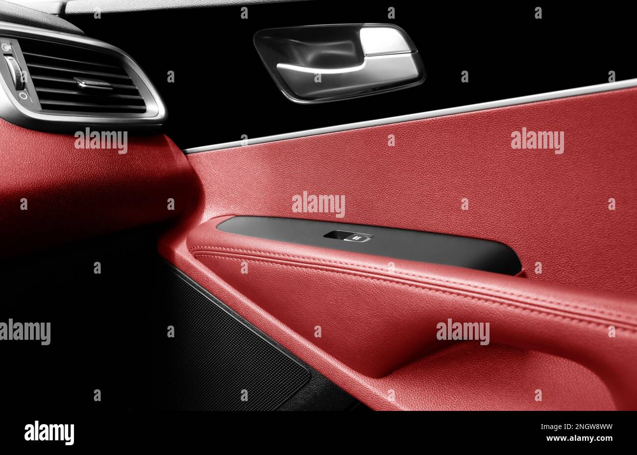 Car door handle inside the luxury modern car with red leather interior ...