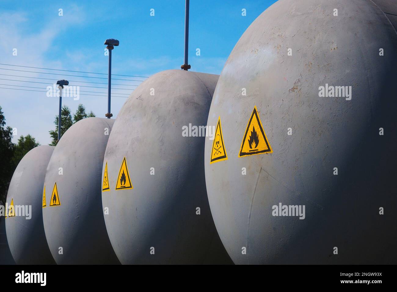 Large gray tanks with dangerous and poisonous cargo stand outside in ...