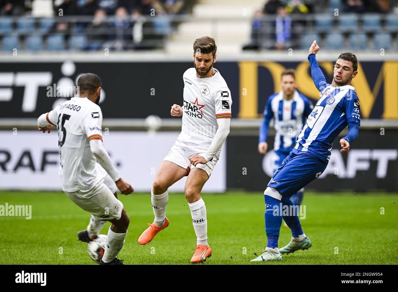 OHL's Mario Gonzalez and Gent's Hugo Cuypers pictured in action during a soccer match between ...