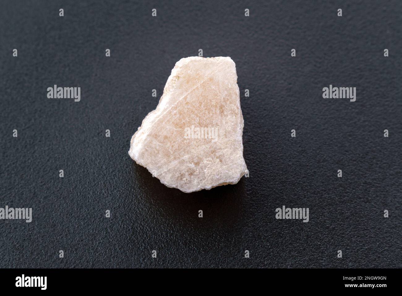 Red Gypsum stone mineral, black background, close-up, black background ...
