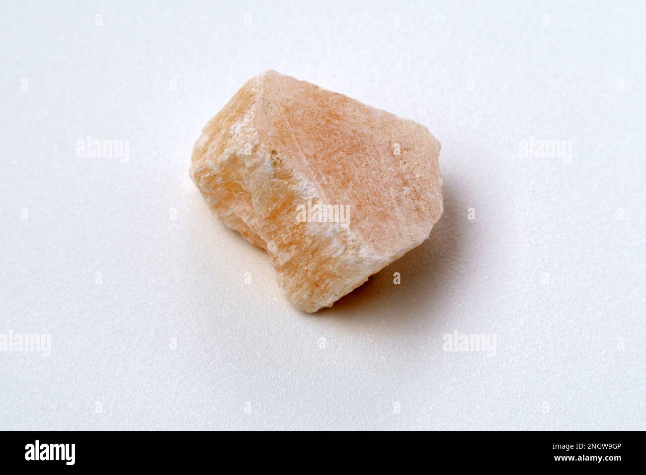 An unworked fragment of red gypsum, white background Stock Photo - Alamy