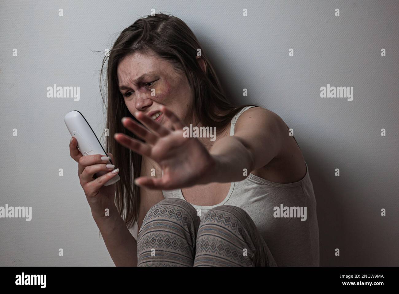 Domestic violence, abuse woman fear, calls on the phone for help Stock ...