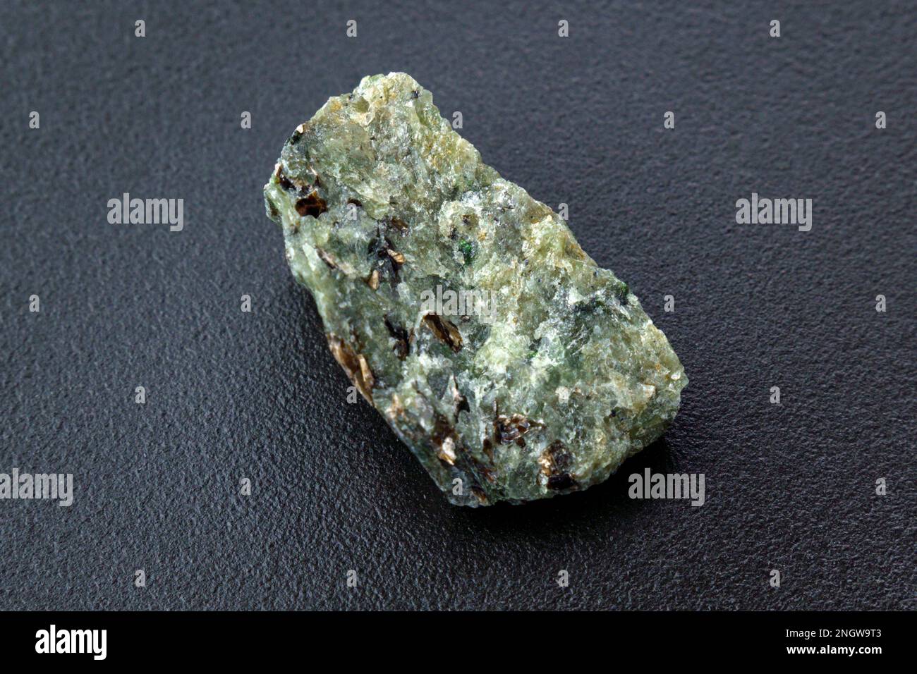 Rock with peridot olivine mineral, black background. Close-up Stock ...