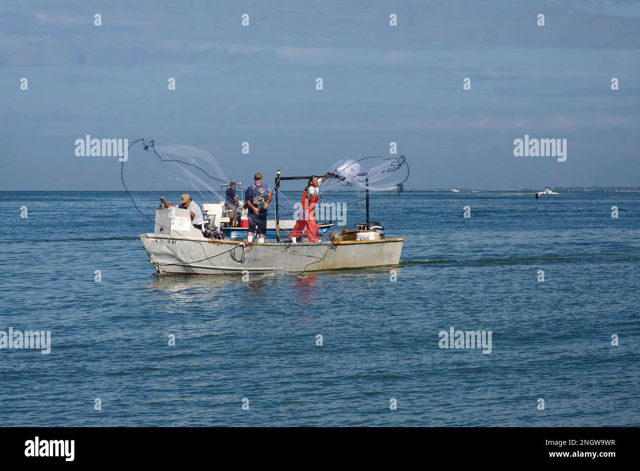 2 boats anchored, men fishing, throwing nets, sport, recreation, blue ...