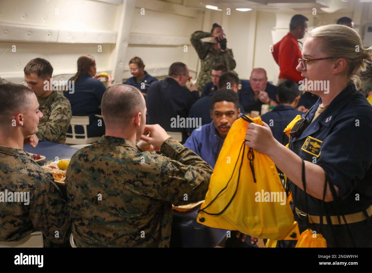PACIFIC OCEAN (Nov. 24 2022) LT. Megan McCoy hands out care packages ...