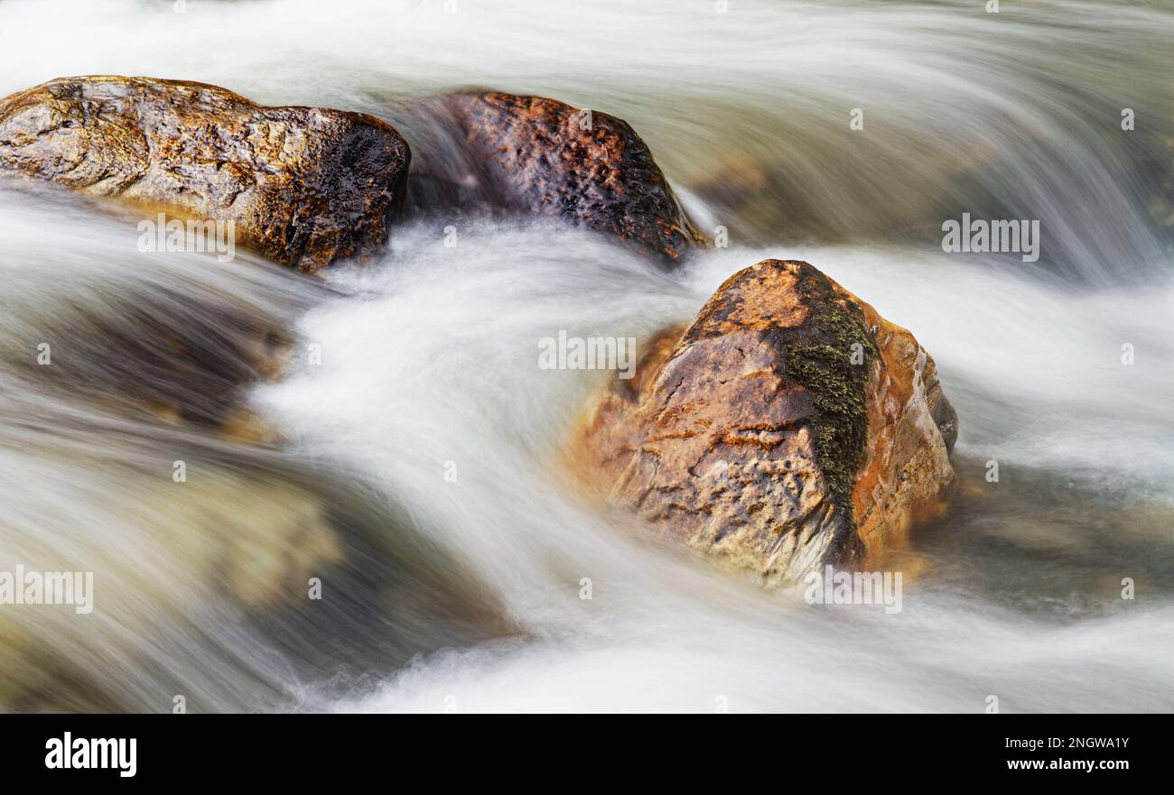 Water running over rocks Stock Photo - Alamy