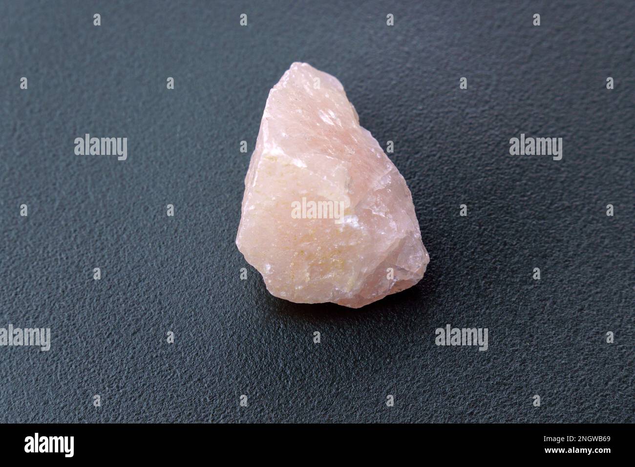 Rose quartz, stone silicate mineral. Rough, uncut, pinkish color black ...