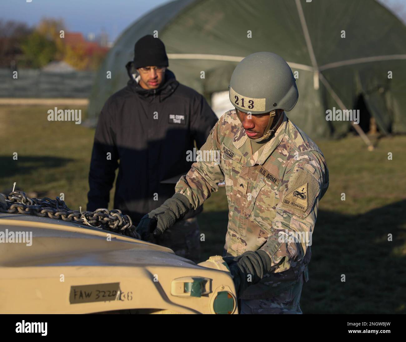A soldier from 1st Armored Division inspects a High Mobility ...