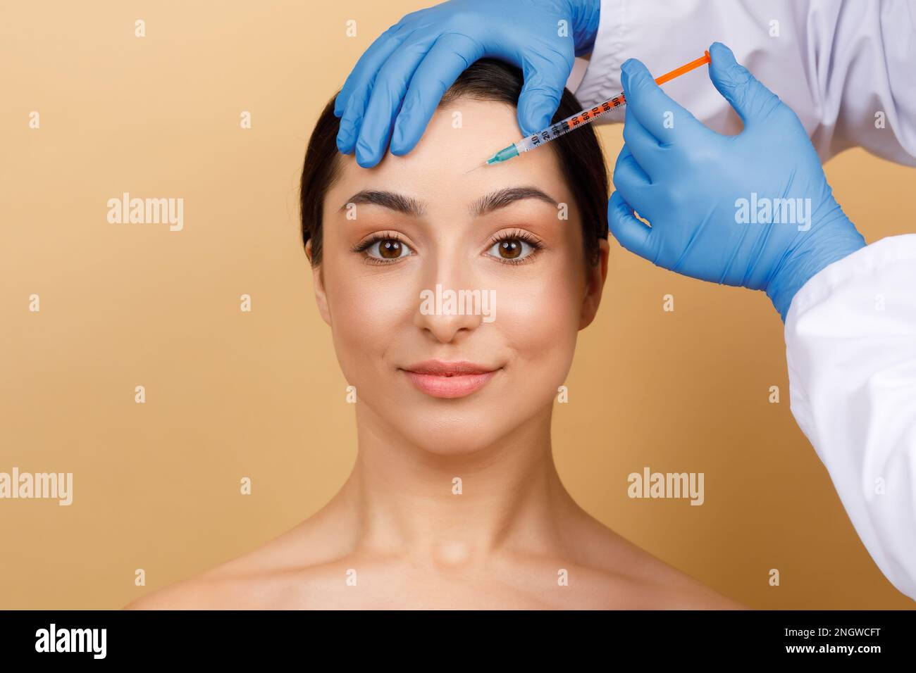 Injection Cosmetology. Beautician Doctor Making Botox Shot To Young ...