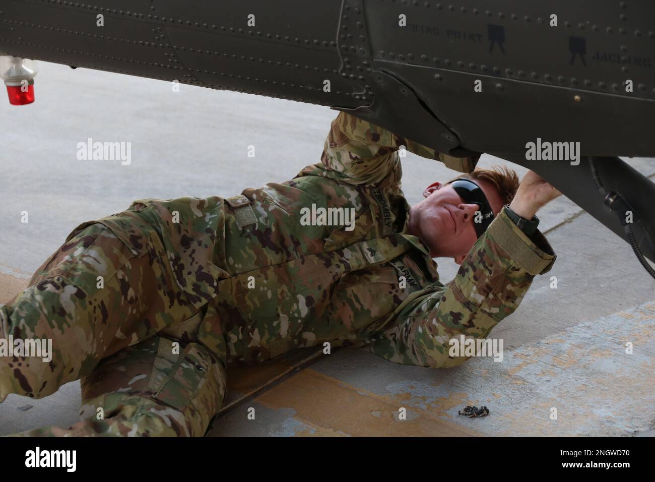 U.S. Army Sgt. Kolton Trombly, crew chief from Alpha Company, 3rd ...