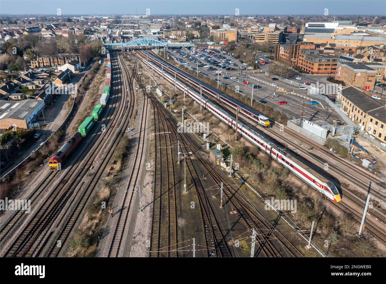 Aerial cityscape view of LNER and freight trains arriving and departing ...