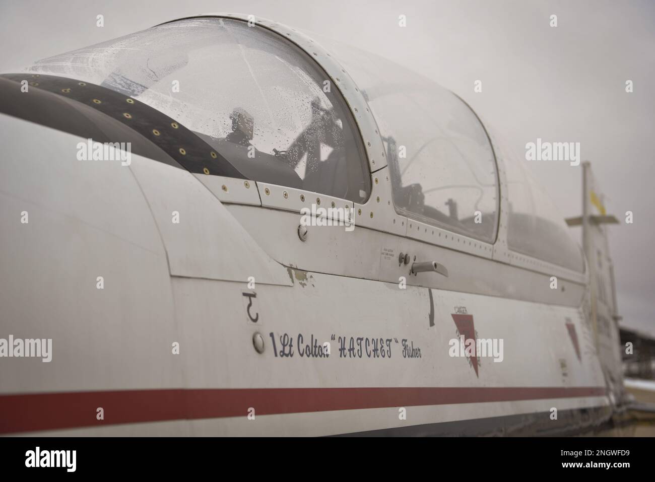Condensation rolls off the canopy of a T-6A Texan II bearing the name ...